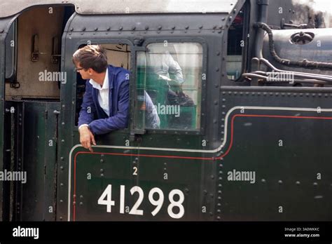 Fireman On The Footplate Of Steam Locomotive Ivatt Class 2 41298 At Havenstreet Station Isle Of