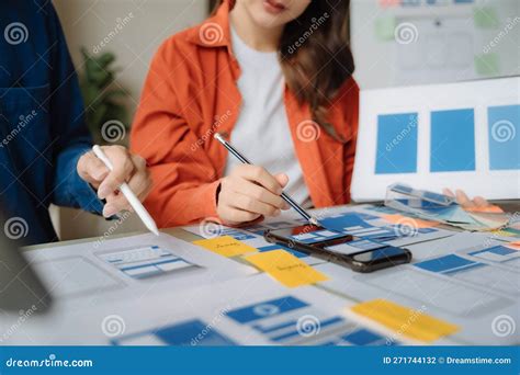 Ui Developer And Ui Designer Brainstorming About Mobile App Interface Wireframe Design With