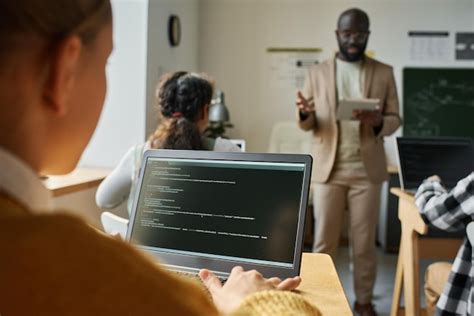 Premium Photo Girl Examining Computer Program At Lesson