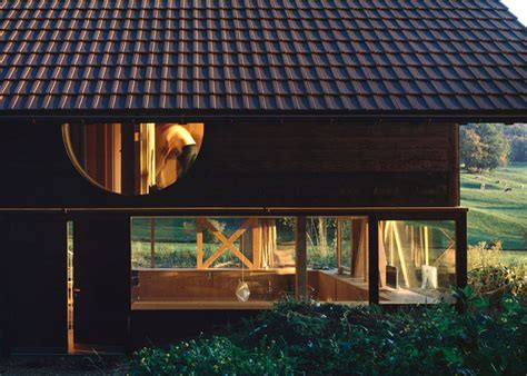 Swiss House By Pascal Flammer With Wooden Braces And A Circular Window