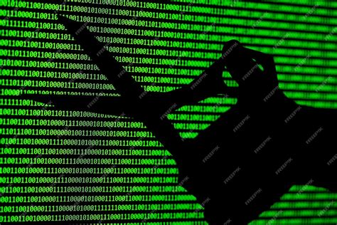 premium photo hacker concept computer binary codes and hand scissors