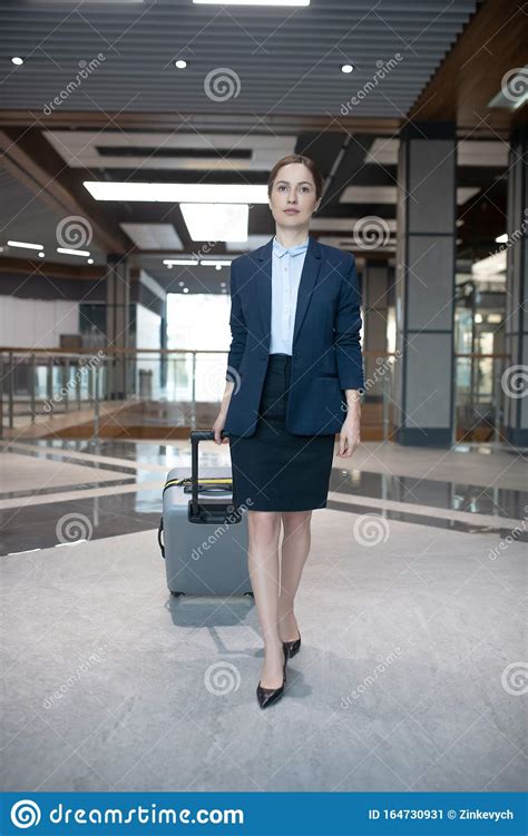 Slim Successful Businesswoman Entering Hotel While Coming For Business