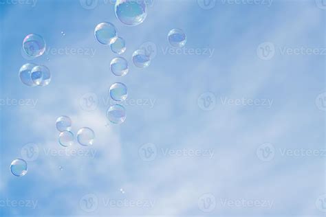Abstract Background Soap Bubbles On Blue Sky Background Copy Space
