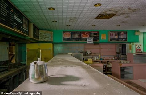 Condiments Coffee Cups And A Vintage Coca Cola Fridge Are Found In