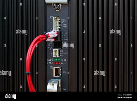 Red Cable Connecting To Input Output Module Of A Programmable Logic Controller With Visible Leds