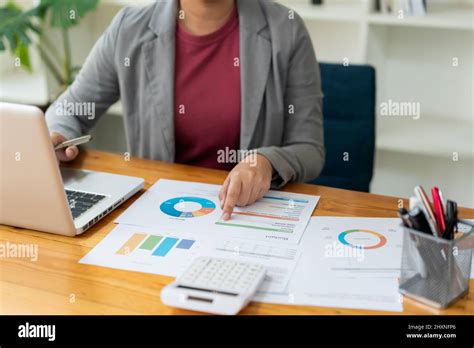 Business Analyst Concept The Data Analyst Holding And Pointing Her Pen At The Document About