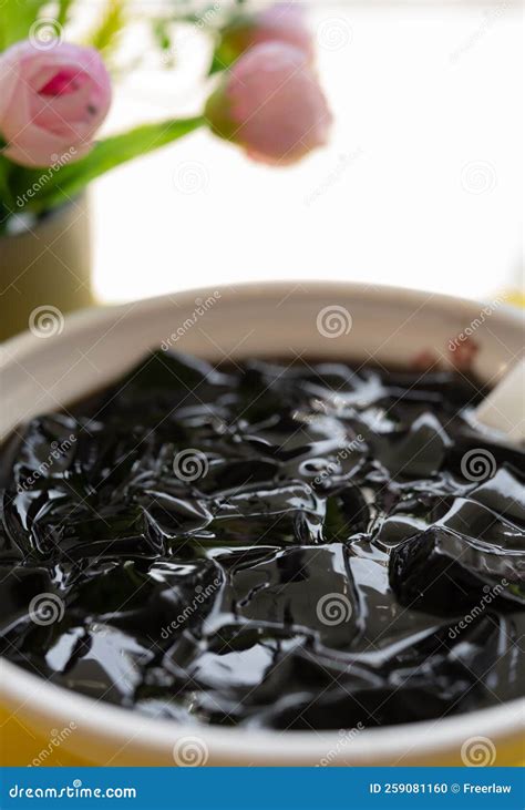 Bowl Of Licorice Black Jelly With Honey Vertical Composition Stock