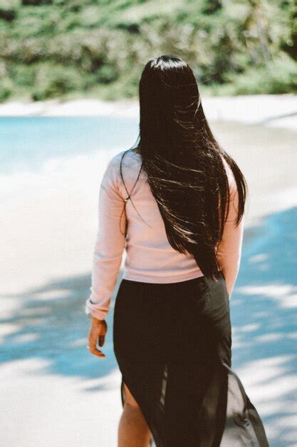 Premium Photo Rear View Of Woman At Beach