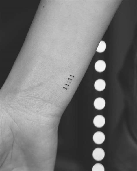 Tattoo Of The Angel Number 11 11 Located On The