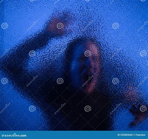 Shadow Of Woman Screaming Behind The Glass Domestic Violence Concept