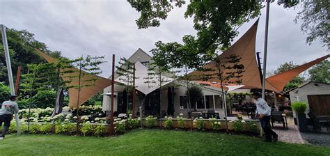 Semi Permanent Removable Shade Sail Structure For A Lanai Area Of A Modern House In Kapaʻa