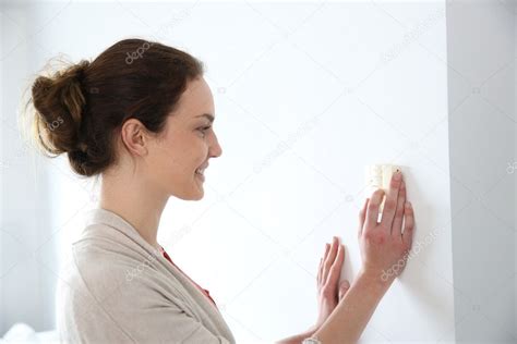 Woman Programming Temperature Stock Photo By Goodluz