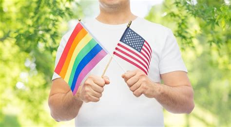 Premium Photo Man With Gay Pride Rainbow And American Flag