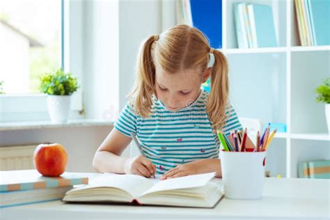 Portrait Of Babegirl At Classroom Writing At The Table Stock Image Image Of Pencil Happy