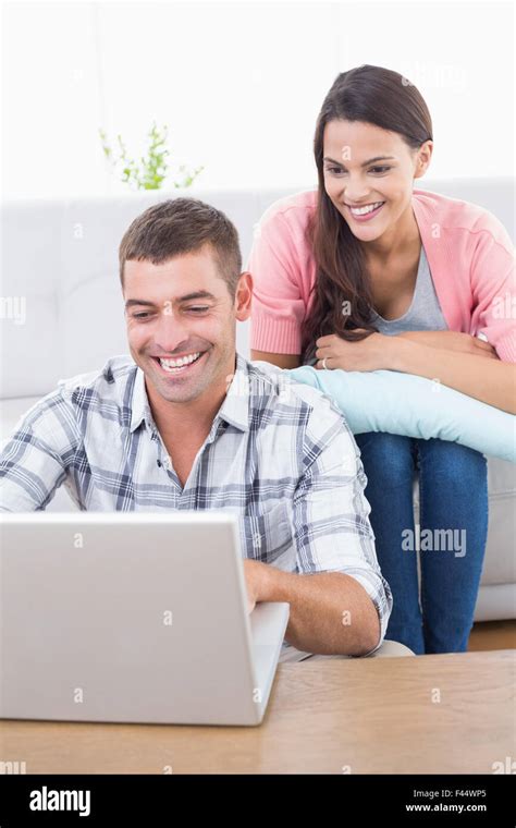 Couple Using Laptop Together Stock Photo Alamy