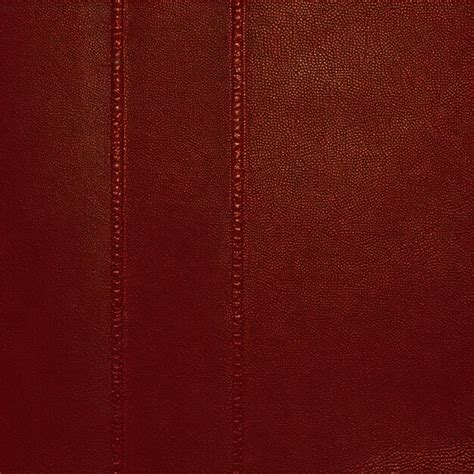 A Red Leather Cover With A Gold Stitched Edge Premium Ai Generated Image