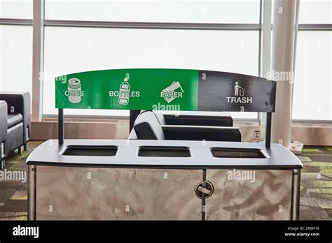 Recycling Receptacle With Trash Section At Airport Terminal Generic