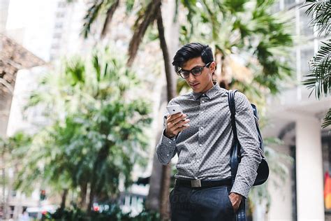 Businessman Using Mobile Phone By Stocksy Contributor Mauro Grigollo Stocksy