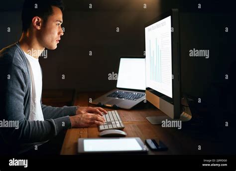 Late Nights Are Normal For A Programmer A Handsome Young Male Programmer Working Late In His