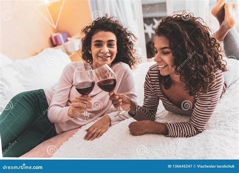 Two Sisters Having Wonderful Evening Drinking Wine Stock Image Image