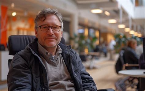 Premium Photo Man Sitting In Chair At Computer Generative Ai