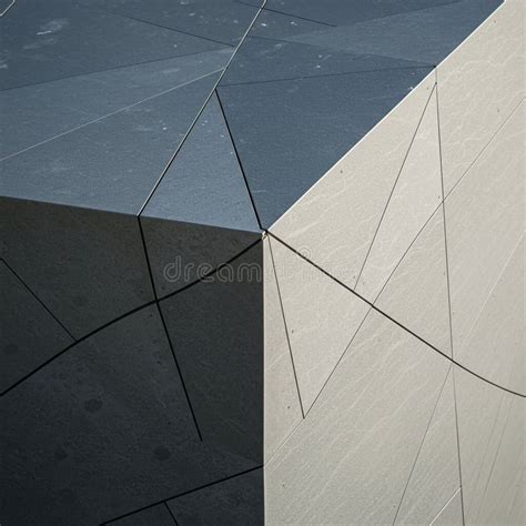 Geometric Building Facade With A Corner Design Composed Of Dark And Light Triangular Stock