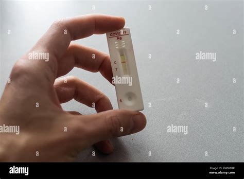 Hand Holding Rapid Coronavirus Covid 19 Negative Test Device With