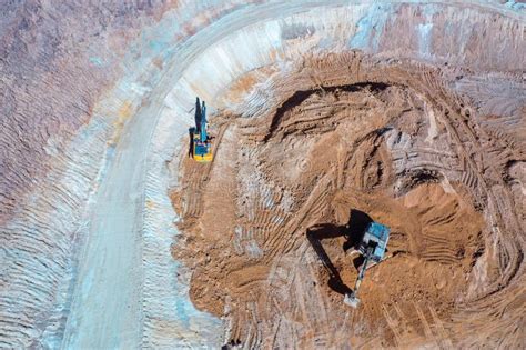 Open Pit Mine In Full Operation With Machinery Extracting Minerals
