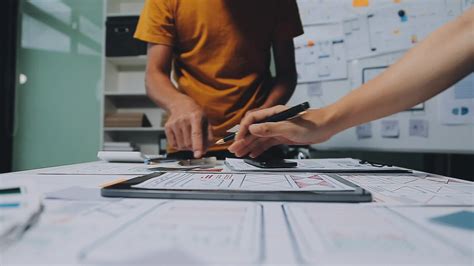 Young Asian Woman Leading Business Creative Team In Mobile Application Software Design Project