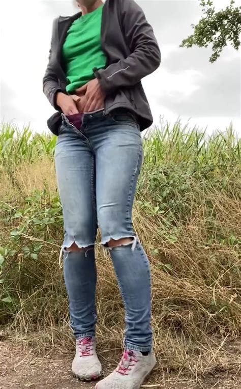 Girl With Nice Ass Pulls Pants Down Pees By Tall Grass ThisVid