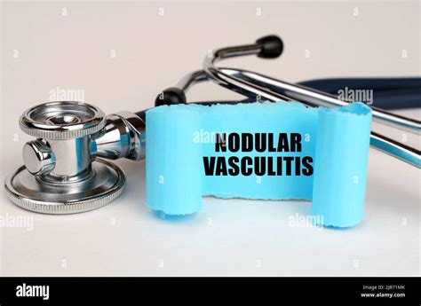 Medical Concept On A White Surface Lies A Stethoscope And A Blue Roll Of Paper With The