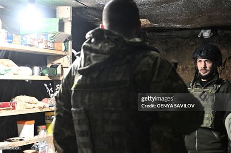 Ukrainian Servicemen Speak In A Dugout At A Position Near The Town Of
