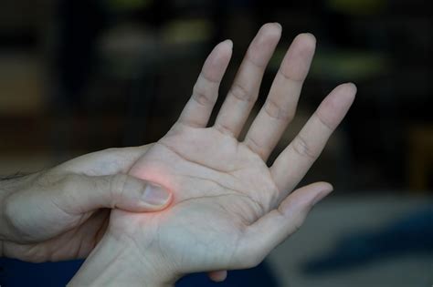 Premium Photo Young Man Has Hand Pain After Working On A