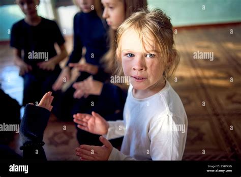 Group Of Pre Teens Perform A Teachers Task During An Acting Class
