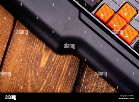 Orange Arrow Keys On A Black Keyboard Up Down Left Right Buttons On