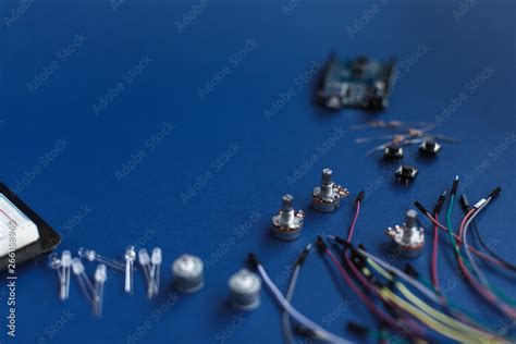DIY Electronic Kit On The Blue Background FLAT LAY Variety Of Sensor And Tools With Copy Space