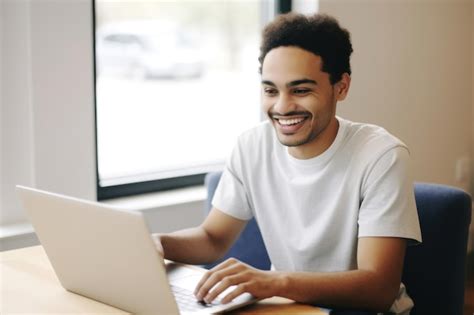 Man Works Laptop Computer Smiling Premium Ai Generated Image