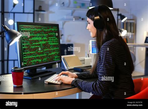 Female Programmer Working With Computer In Office At Night Stock Photo Alamy