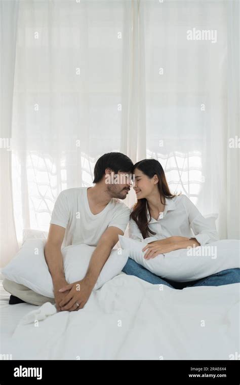 Asian Romantic Couple In Bed Enjoying Sensual Foreplay Happy Sensual