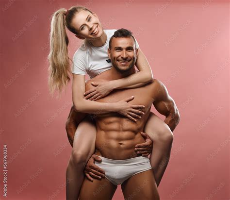 Sport Handsome Couple At Pink Background Fitness Male And Female