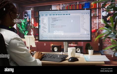 Woman In Home Office Looking At Ui On Pc Screen Typing And Executing