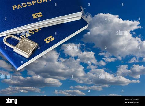 New Blue Biometric Passport With Identification Chip On Against Blue Sky Stock Photo Alamy