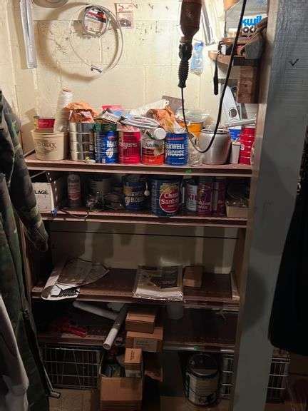 Metal Shelf And Contents And Drill Bit And Tools On Shelf Above Metzger Property Services Llc