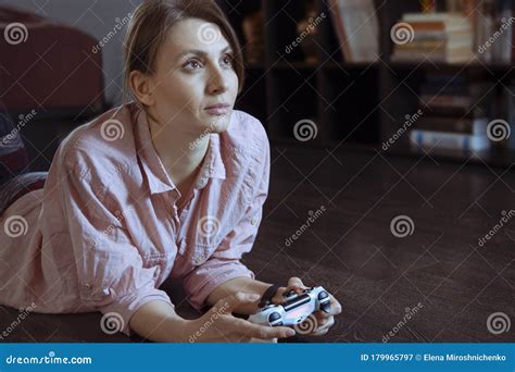 Young Attractive Woman With Dark Hair And Eyes Plays Computer Game