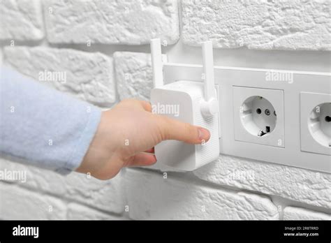 Woman Turning On Wireless Wi Fi Repeater Indoors Closeup Stock Photo Alamy