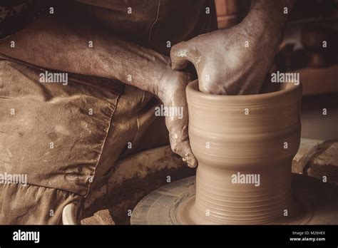 Elderly Man Making Pot Using Pottery Wheel In Studio Stock Photo Alamy
