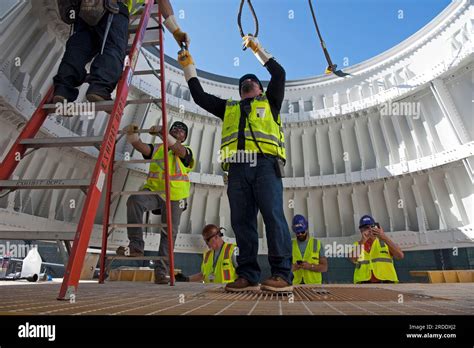 Workers Attach Rigging To Allow Crane To Lift An Aft Skirt From The