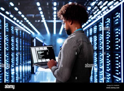 Cloud Computer Engineer Coding In Server Room In Data Center