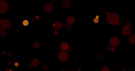 Red Bokeh On Particles Floating In The Air Dust And Glitter Particles Background Black