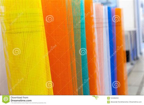 Set Of Fiberglass Netting Reinforcing Mesh Rolled Up In A Roll For The Insulation Of Walls Stock